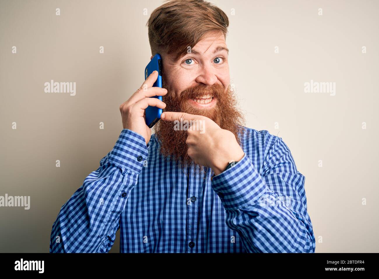 Redhead Irish man with beard having a conversation talking on ...