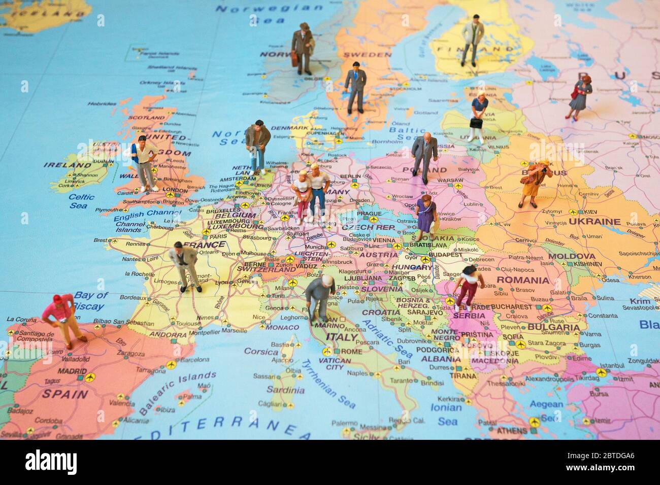 Many figures of people are placed on Europe map. Open borders concept ...