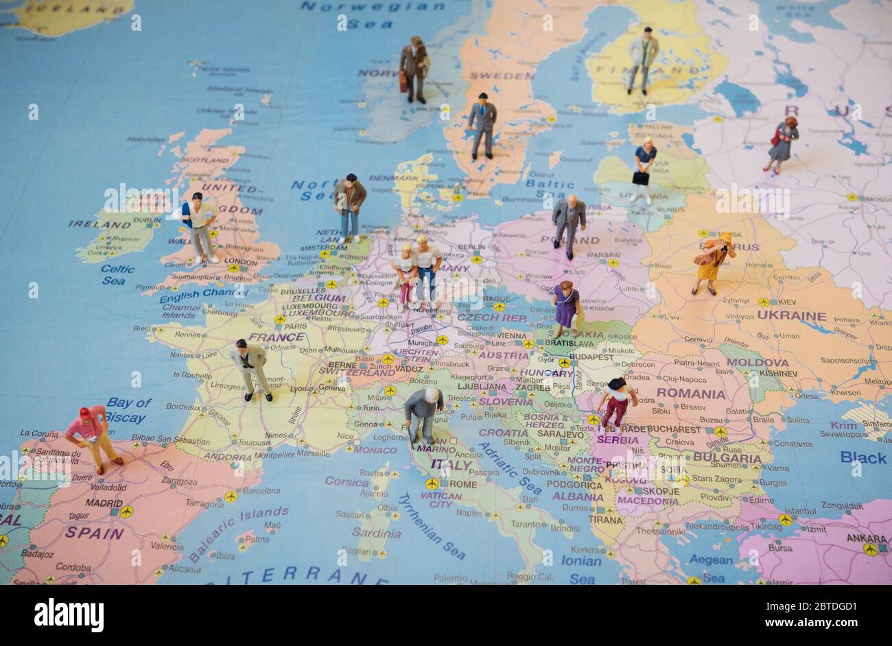 Many figures of people are placed on Europe map. Open borders concept ...
