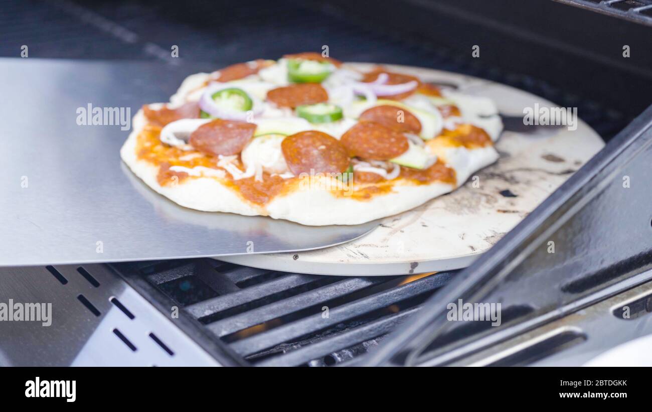 Cooking pizza on outdoor gas hi-res stock photography and images - Alamy