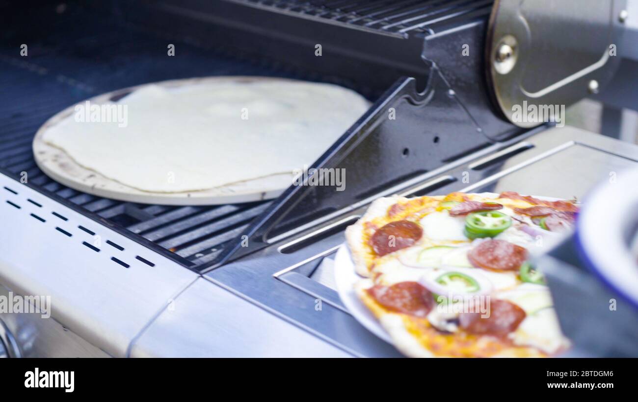 Cooking pizza on outdoor gas hi-res stock photography and images - Alamy