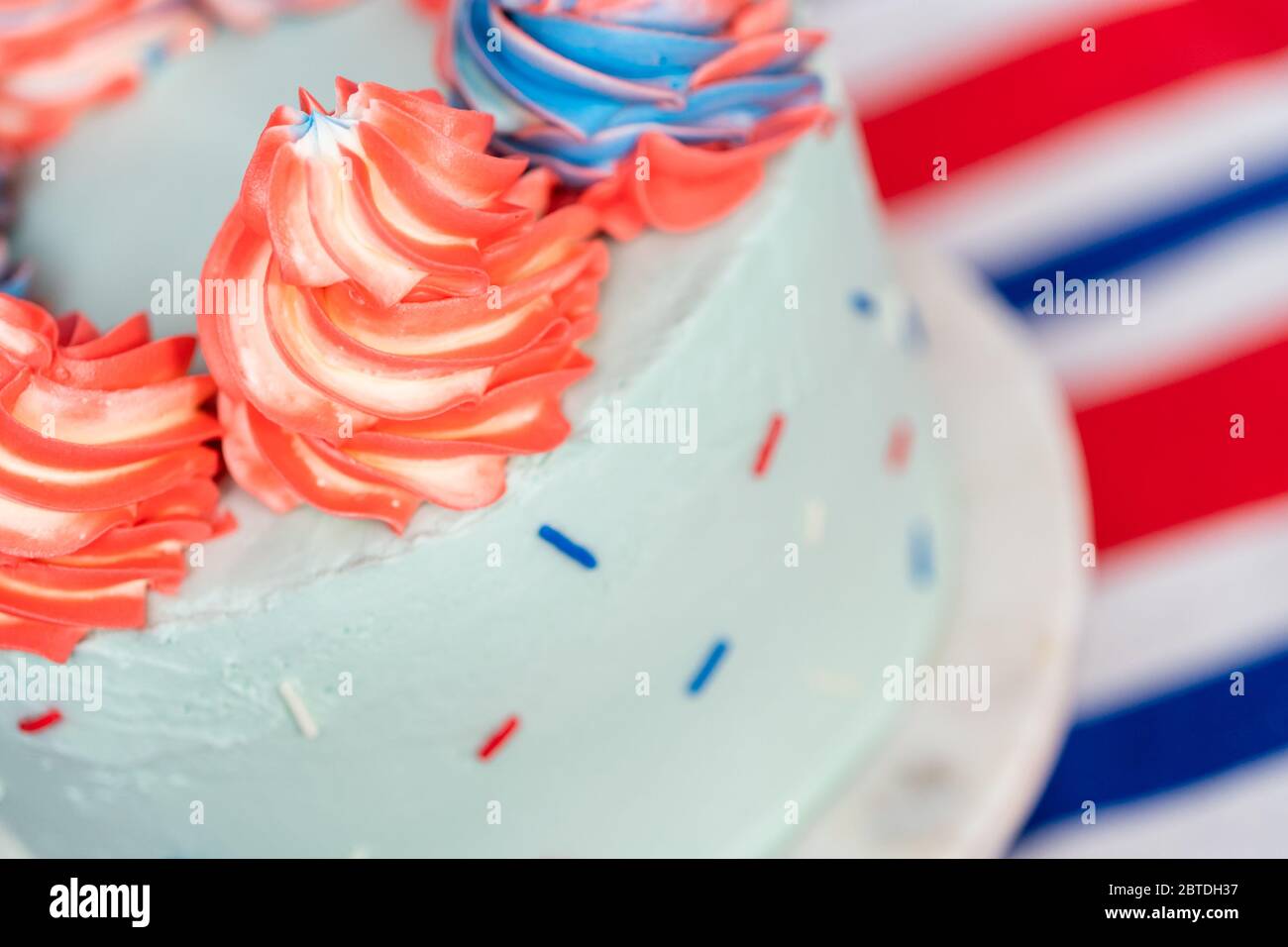 Red, white, and blue round vanilla cake with buttercream frosting for ...