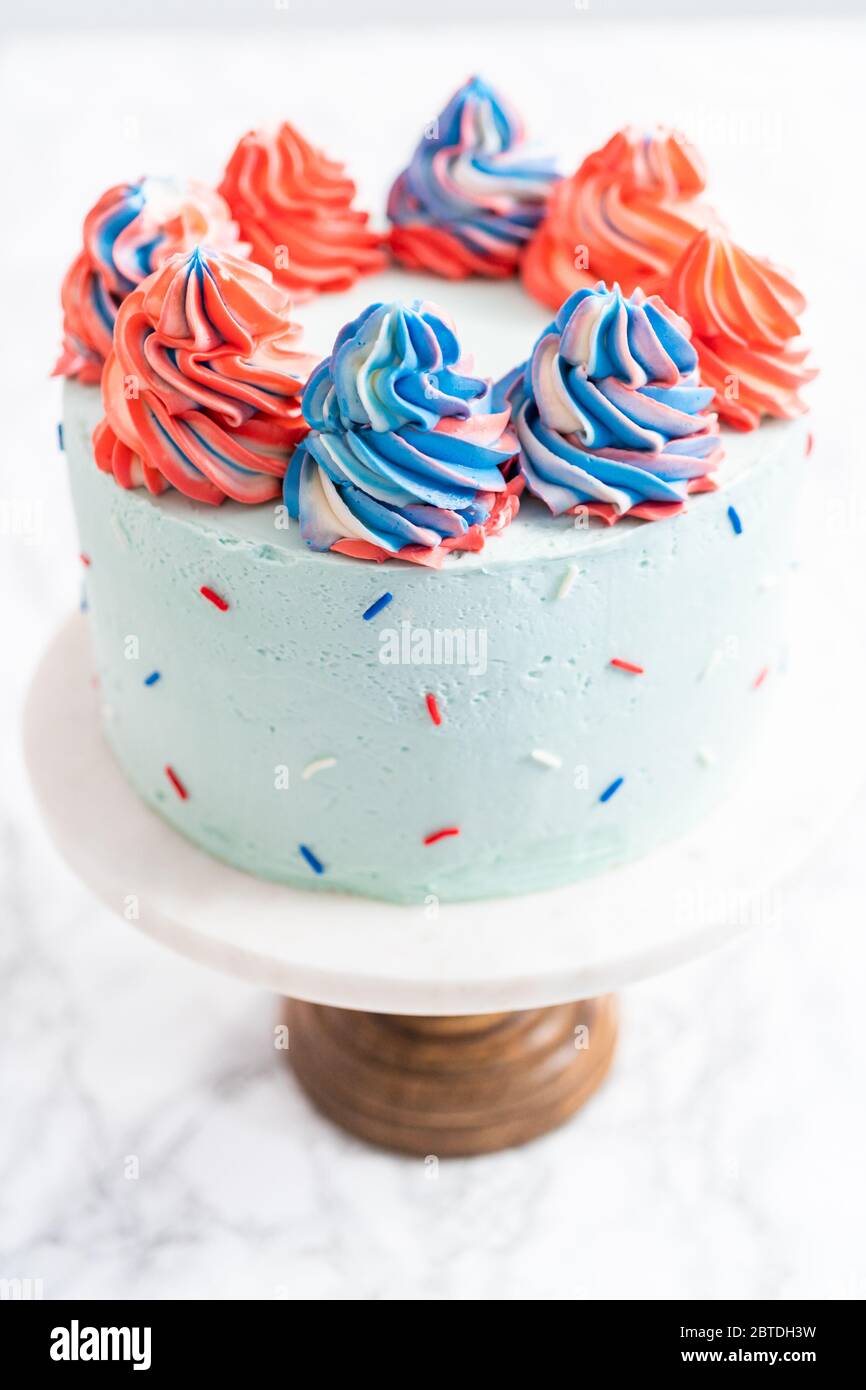 Red, white, and blue round vanilla cake with buttercream frosting for ...