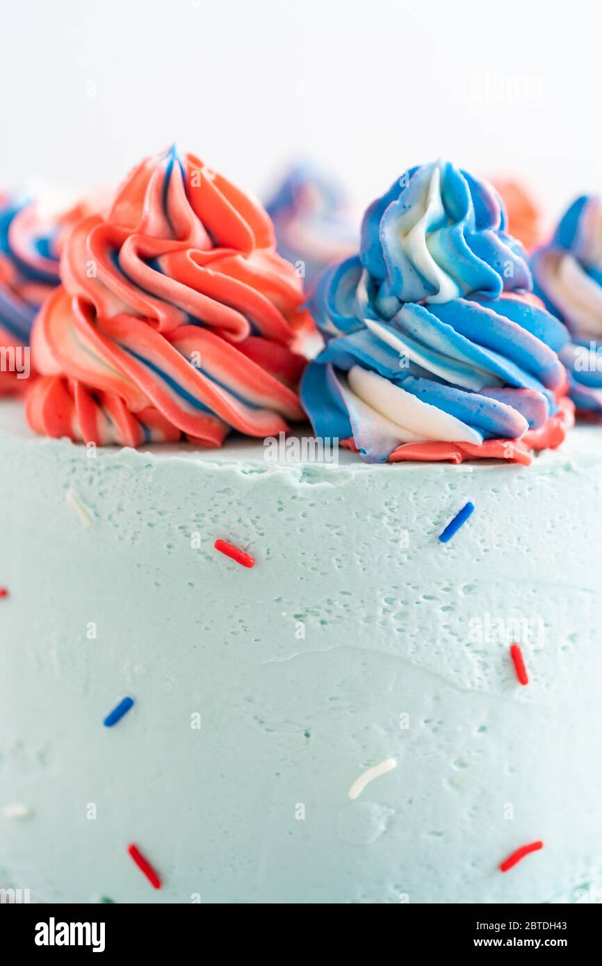 Red, white, and blue round vanilla cake with buttercream frosting for ...