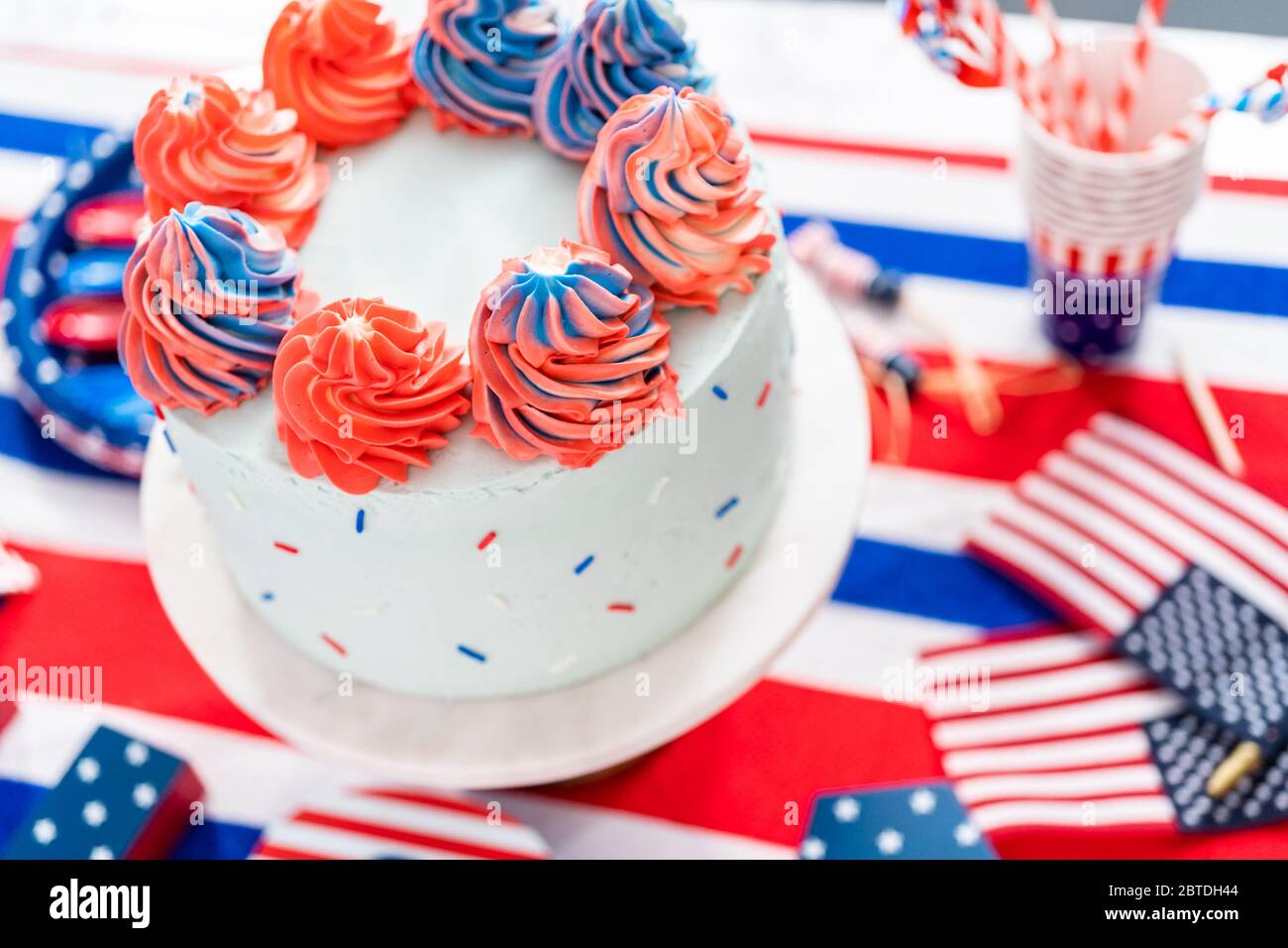 Red, white, and blue round vanilla cake with buttercream frosting for ...