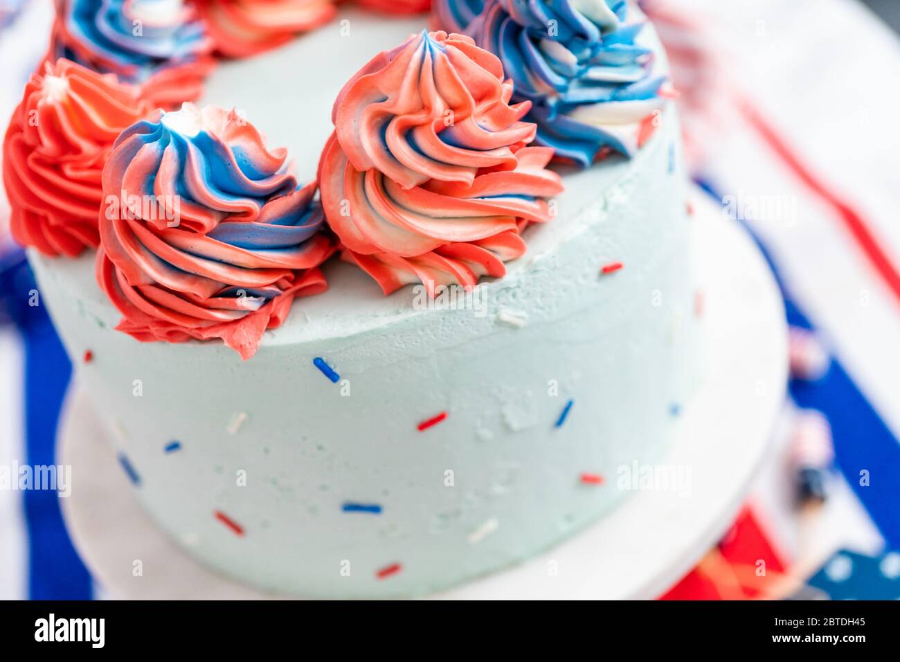 Red, white, and blue round vanilla cake with buttercream frosting for ...