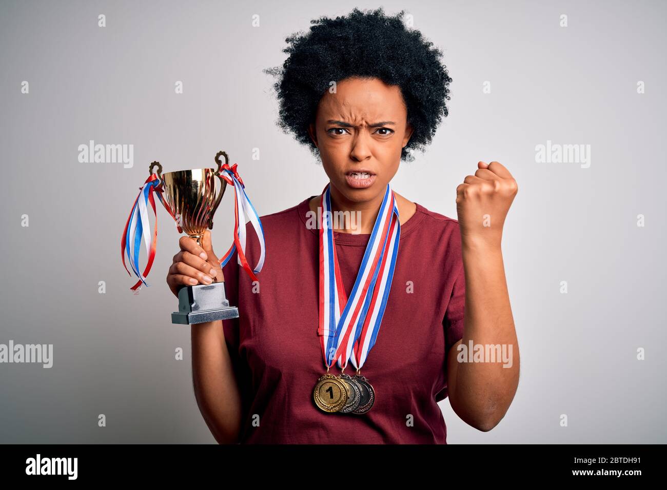 Young African American afro athlete woman with curly hair wearing ...