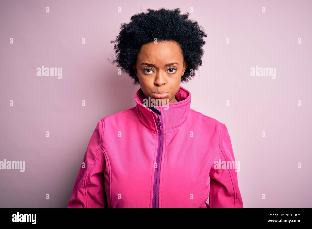Young African American afro sportswoman with curly hair wearing ...