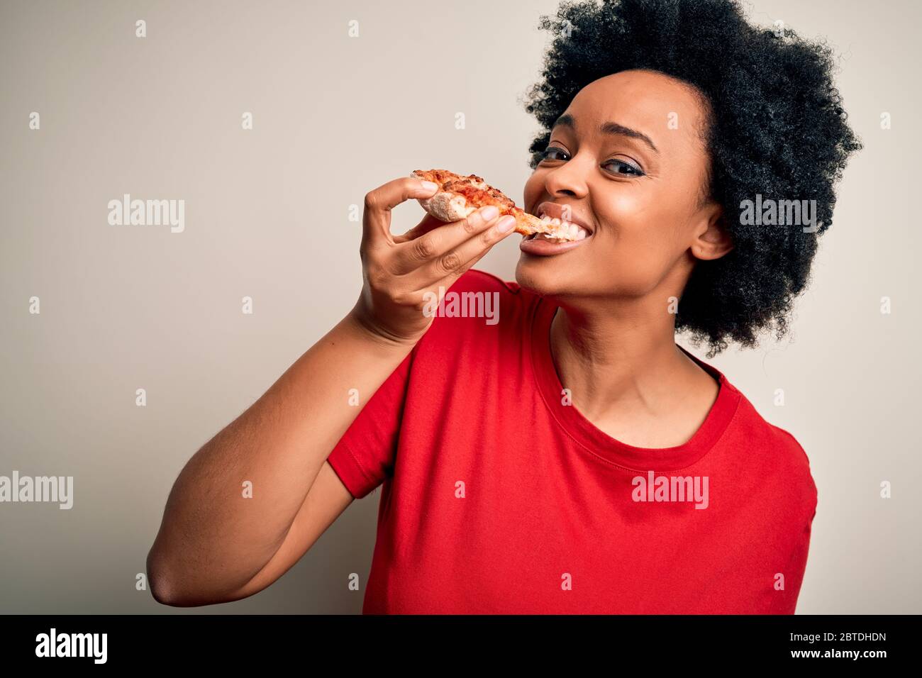 Young beautiful african american afro woman smiling happy and confident ...