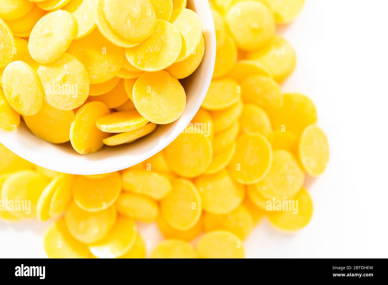 Yellow round chocolate chips for melting chocolate shapes Stock Photo ...