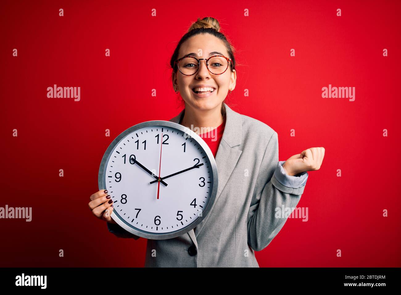 Beautiful blonde woman with blue eyes wearing glasses doing countdown ...