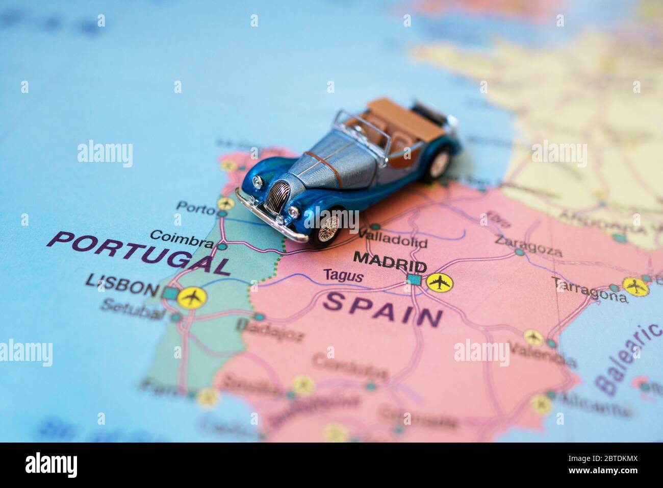 Small toy retro car on Europe map in Spain. Travel by car concept Stock ...