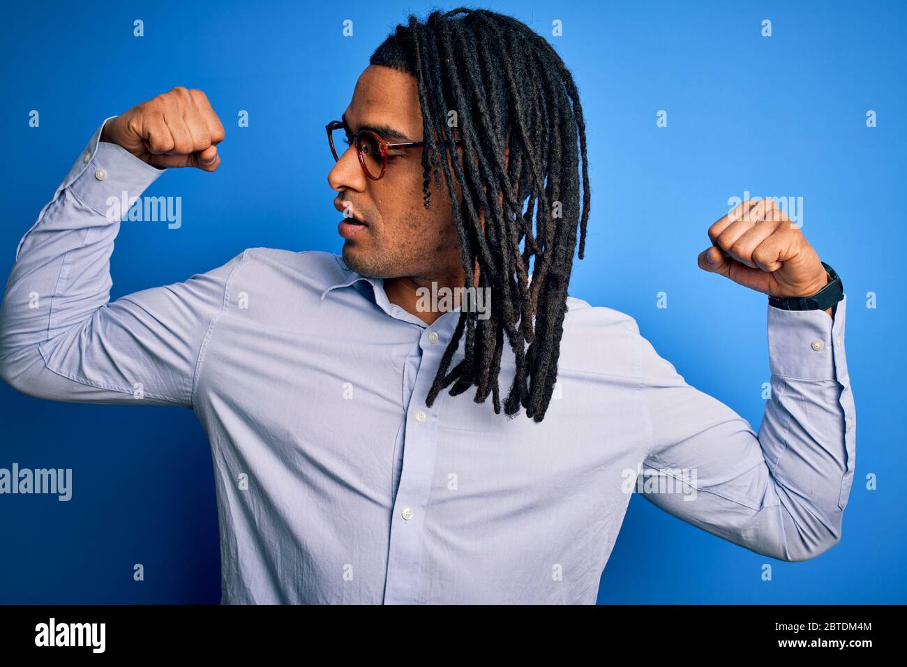 Young handsome african american man with dreadlocks wearing casual ...