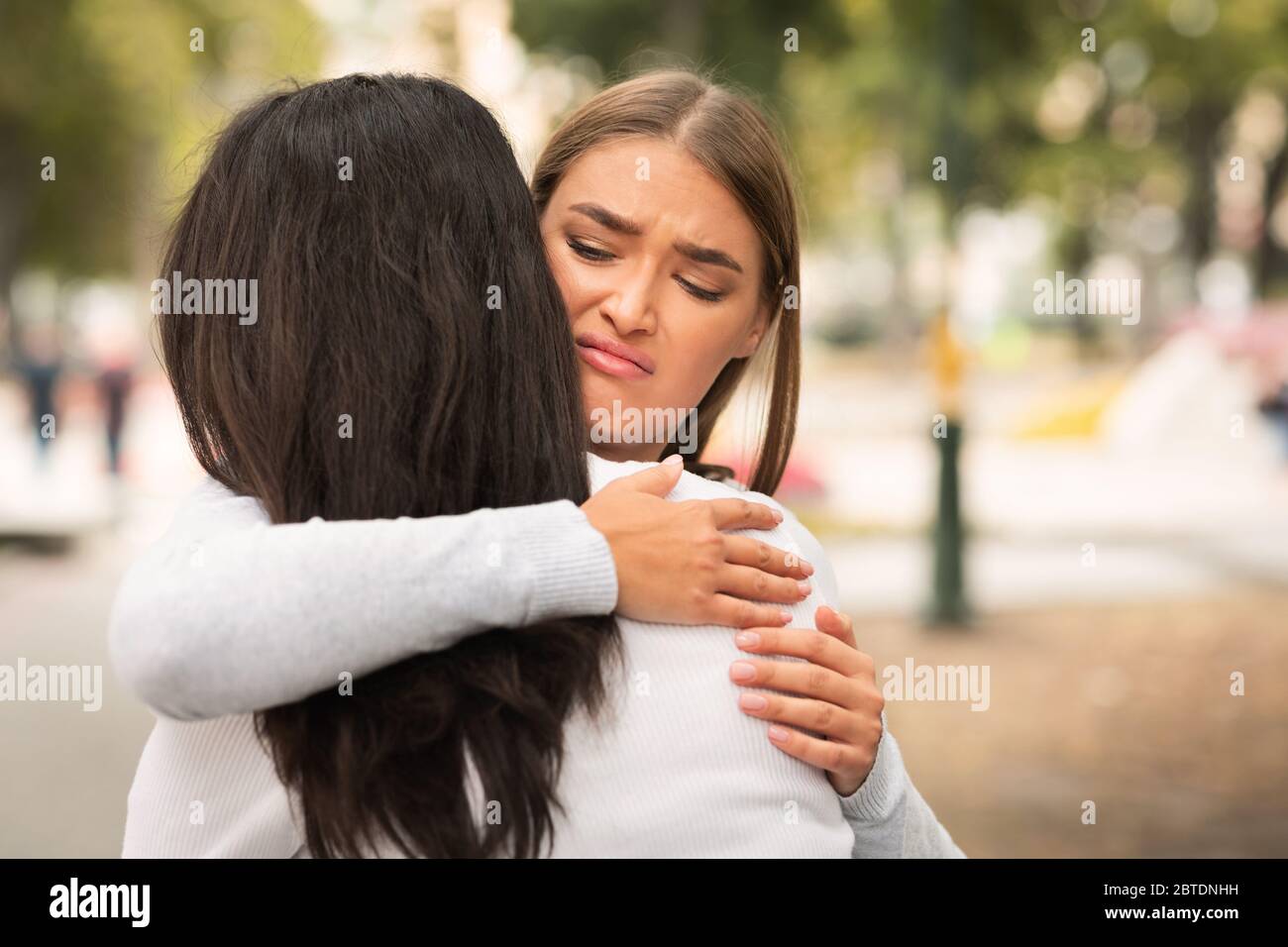 Disgusted Girl Hugging Crying Girlfriend Pretending To Support Her ...