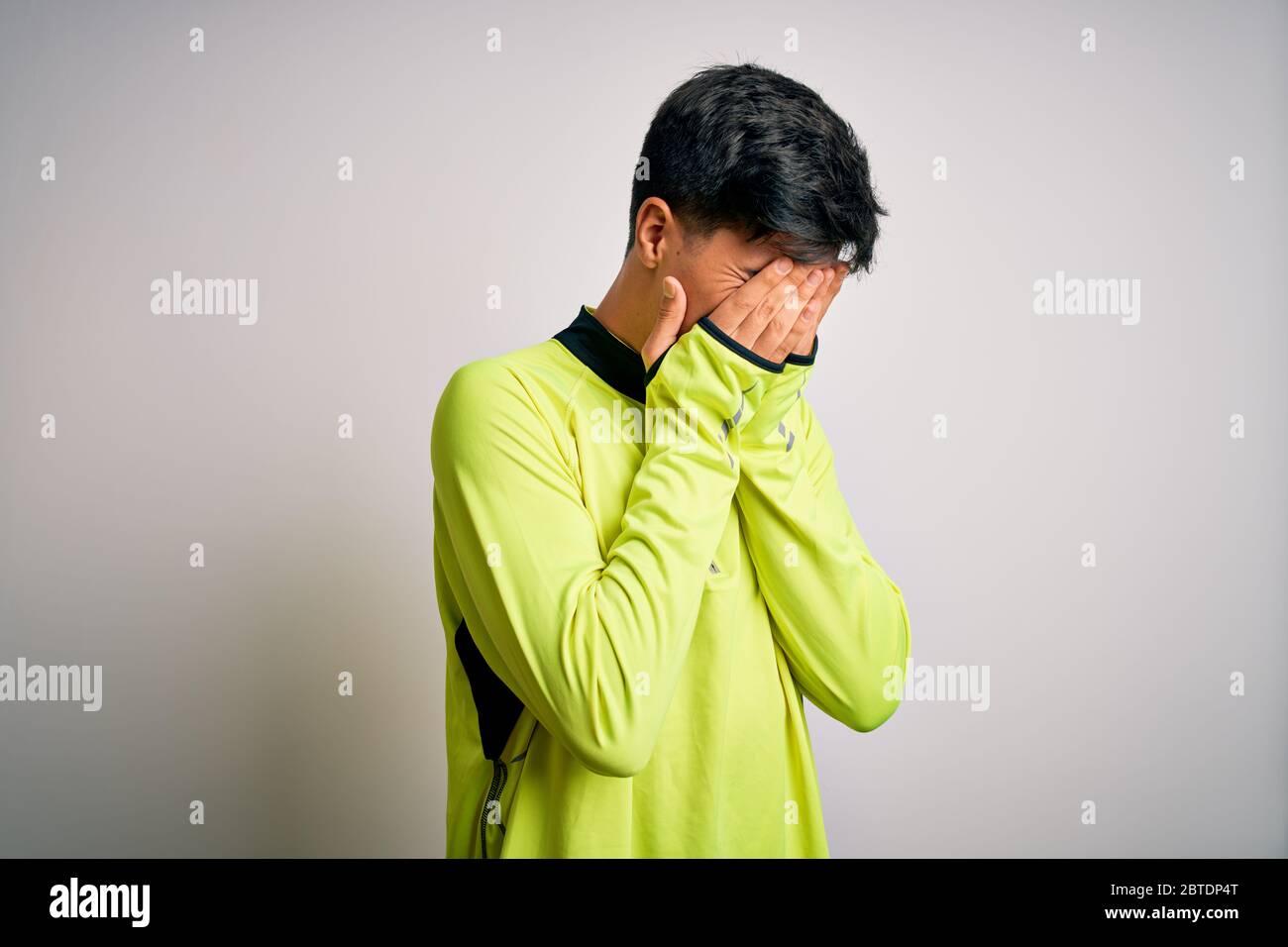 Young handsome sportsman doing sport wearing sportswear over isolated ...