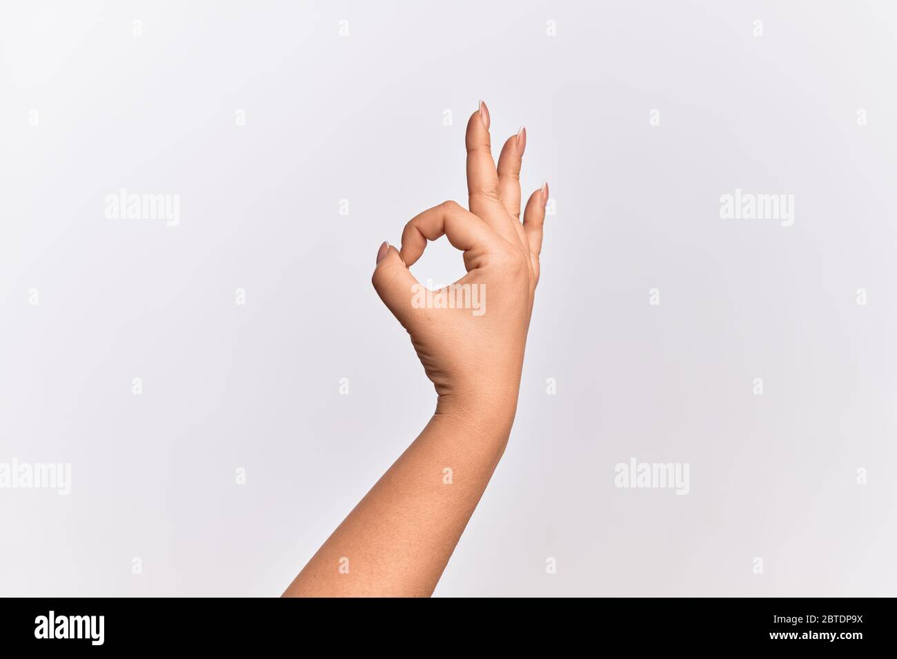 Hand of caucasian young woman gesturing approval expression doing okay ...