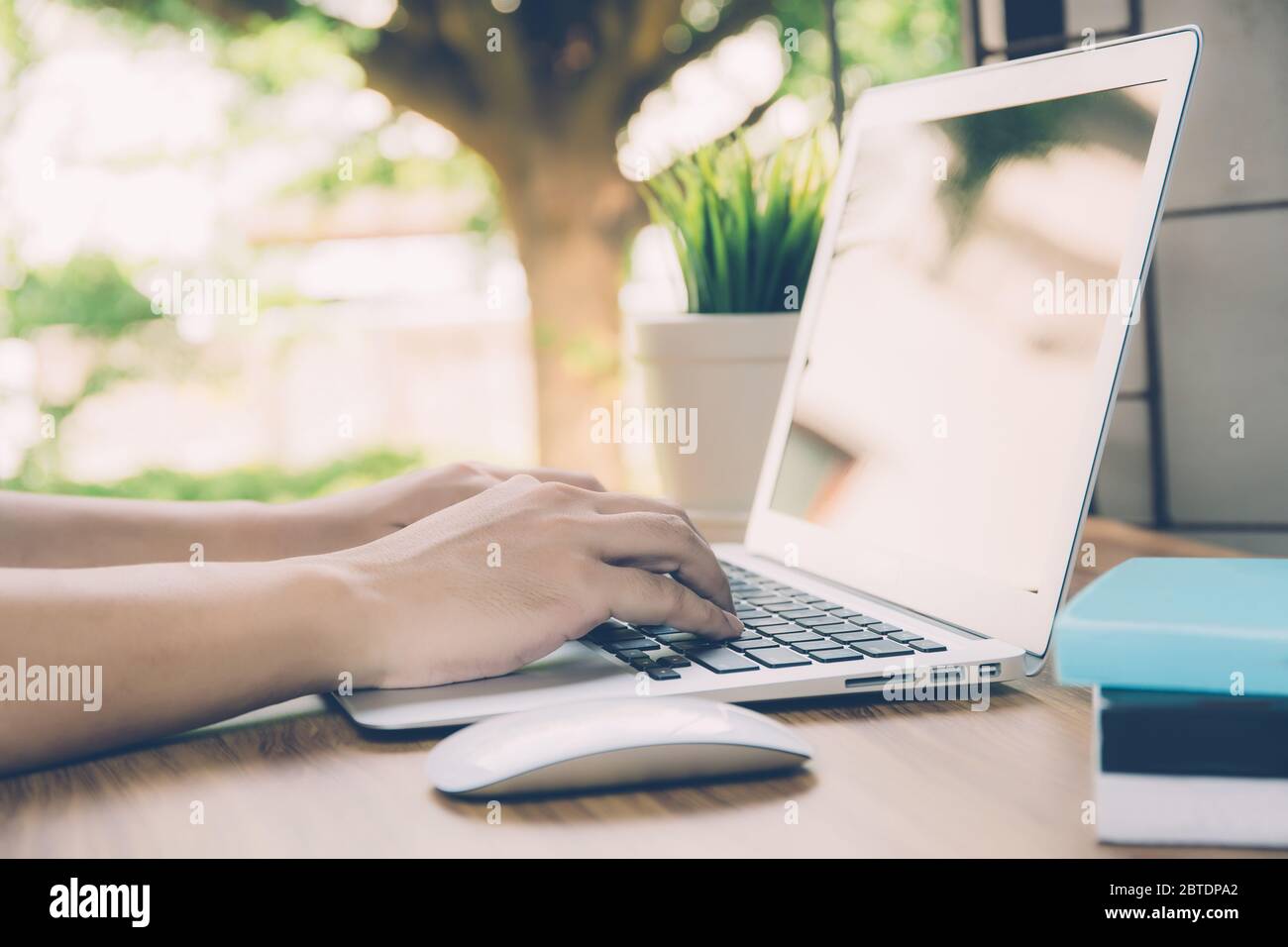 Hand of business man working from home using laptop computer to ...