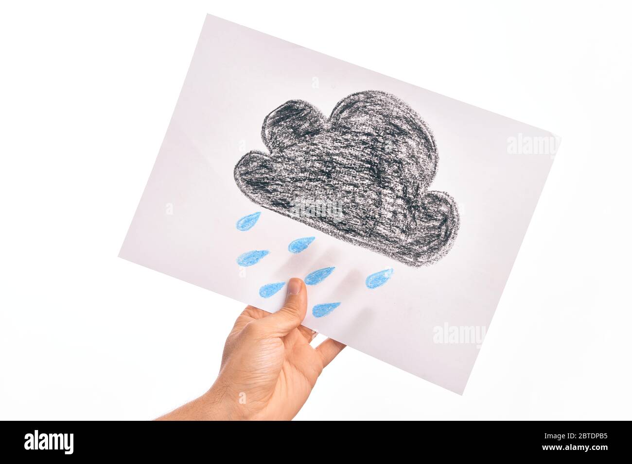 Holding paper sheet with a drawing of a dark cloud with drops, raining ...