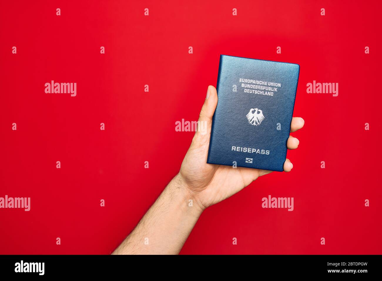 Beautiful hand of man holding german germany passport identification ...