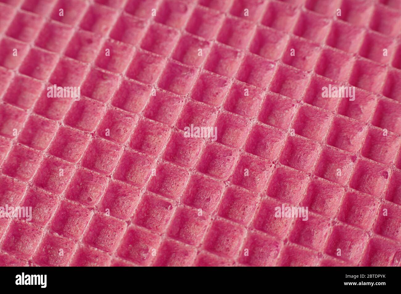 Red waffles surface closeup detail background Stock Photo - Alamy