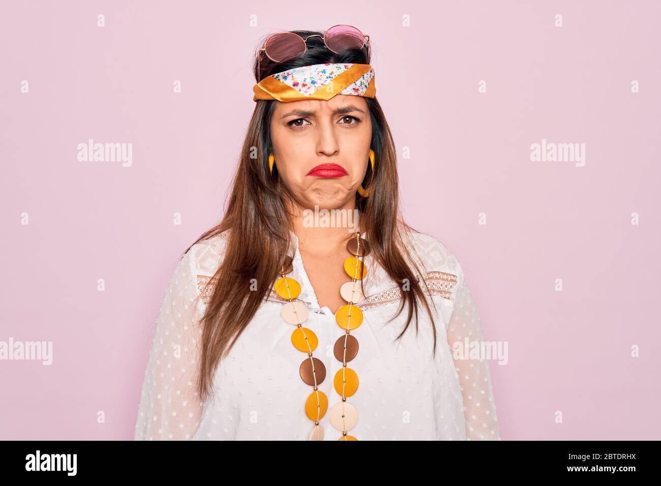Young hispanic hippie woman wearing fashion boho style and sunglasses ...