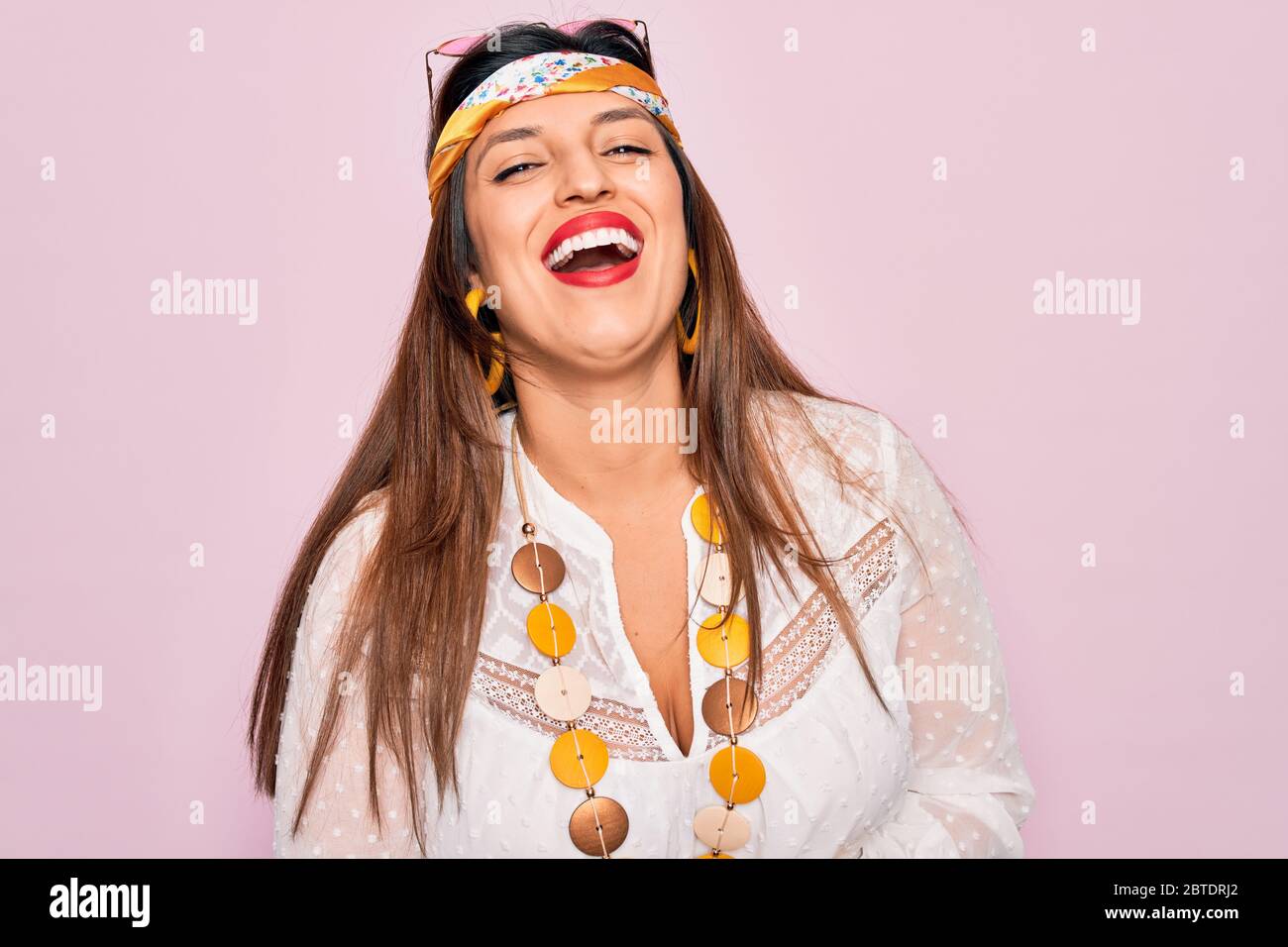 Young hispanic hippie woman wearing fashion boho style and sunglasses ...