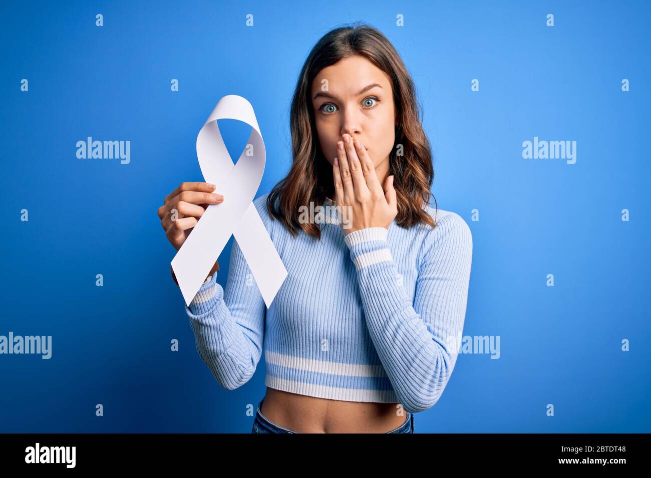Young blonde girl holding stop women violence and lung cancer awareness ...