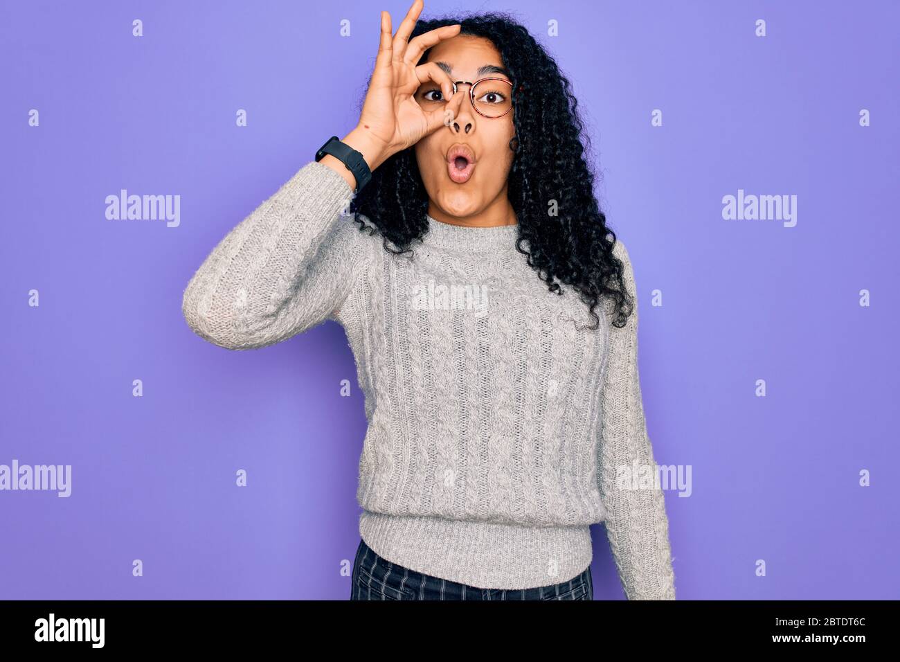 Young african american woman wearing casual sweater and glasses over ...