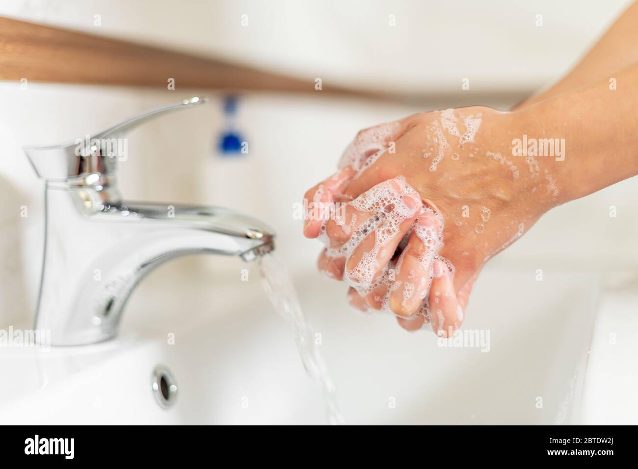 Man washing his hands liquid soap hi-res stock photography and images ...