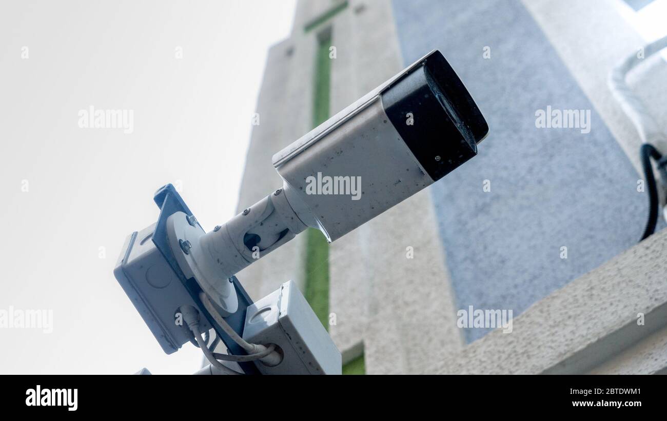 Modern electronic surveillance camera installed on city street Stock Photo - Alamy