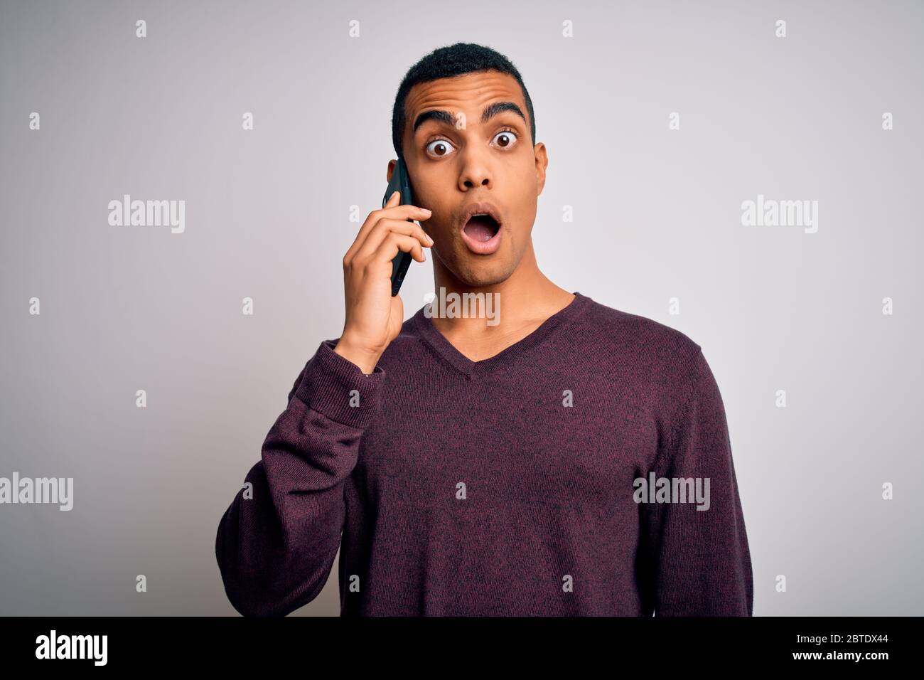 Young handsome african american man having conversation talking on the ...