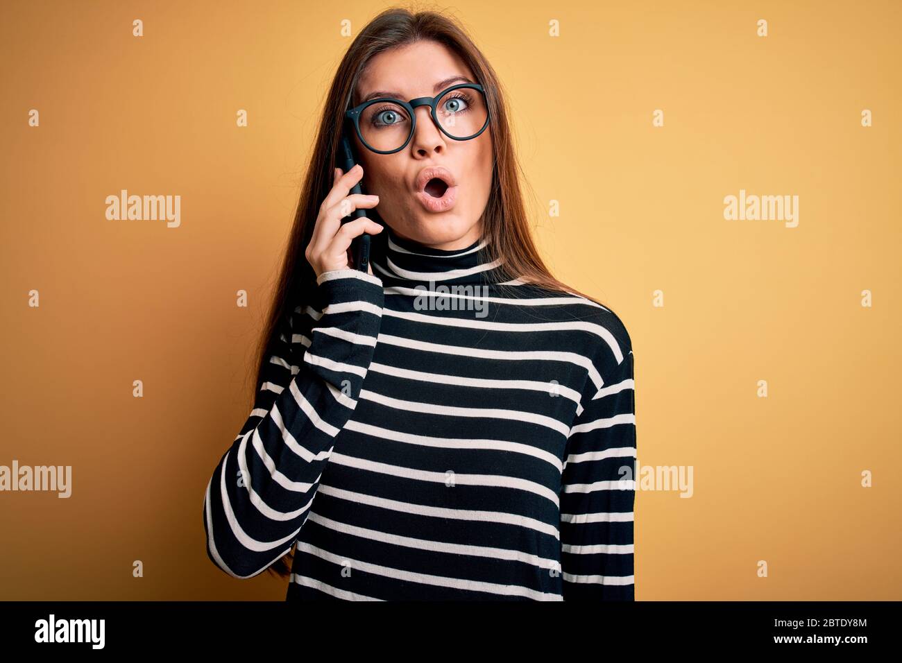Young beautiful woman with blue eyes having conversation talking on the ...