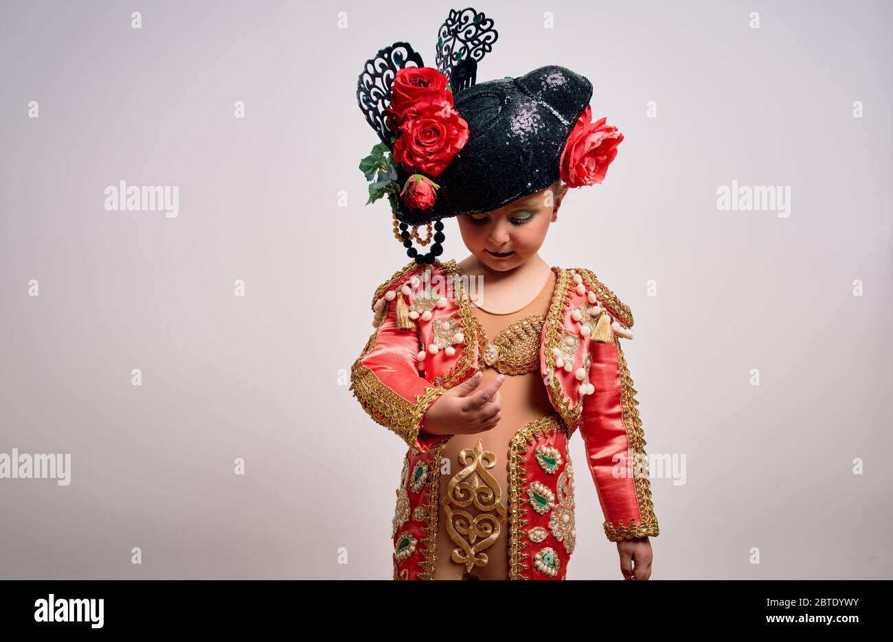 Young little caucasian kid girl wearing bullfighter traditional folkore ...