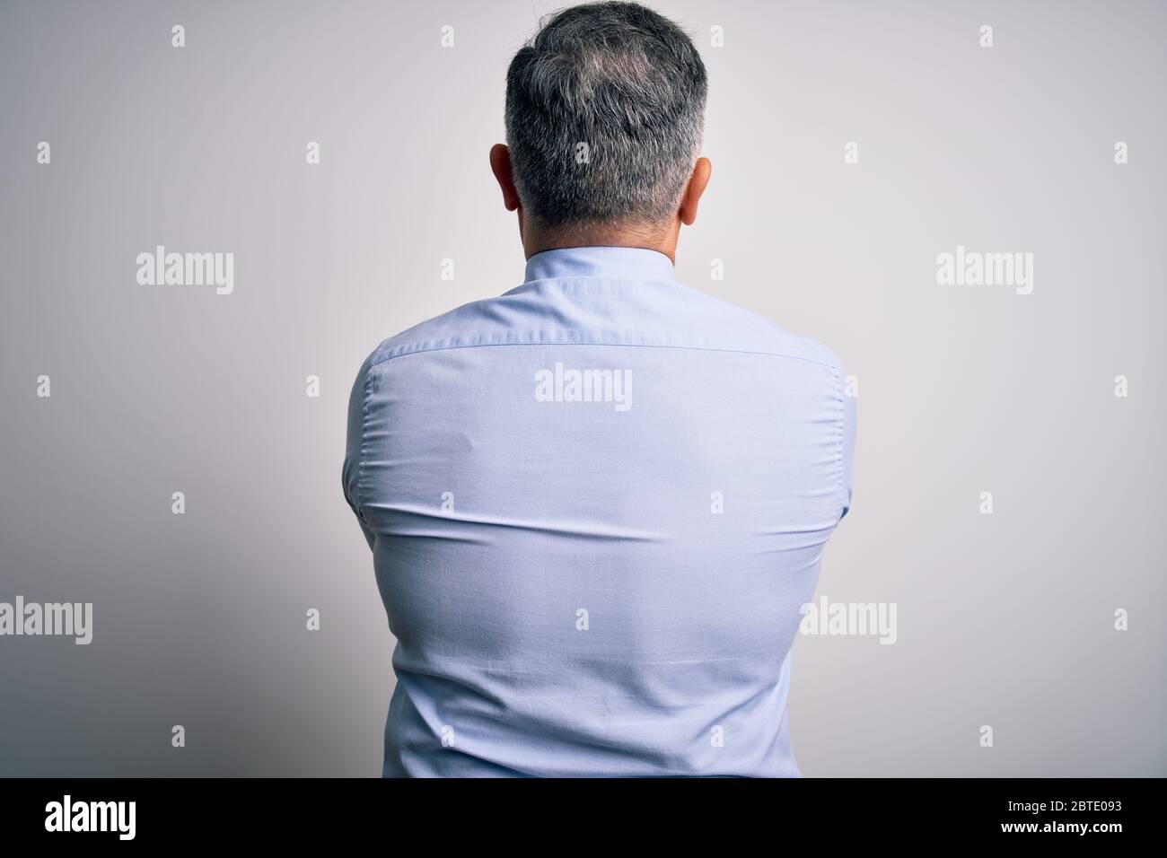 Middle age handsome grey-haired business man wearing elegant shirt and ...