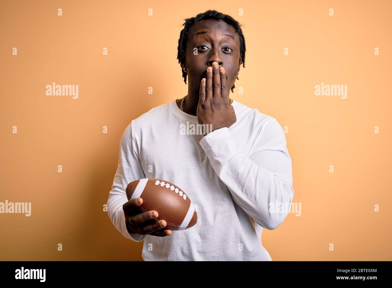 Young african player man playing rugby holding american football ball ...
