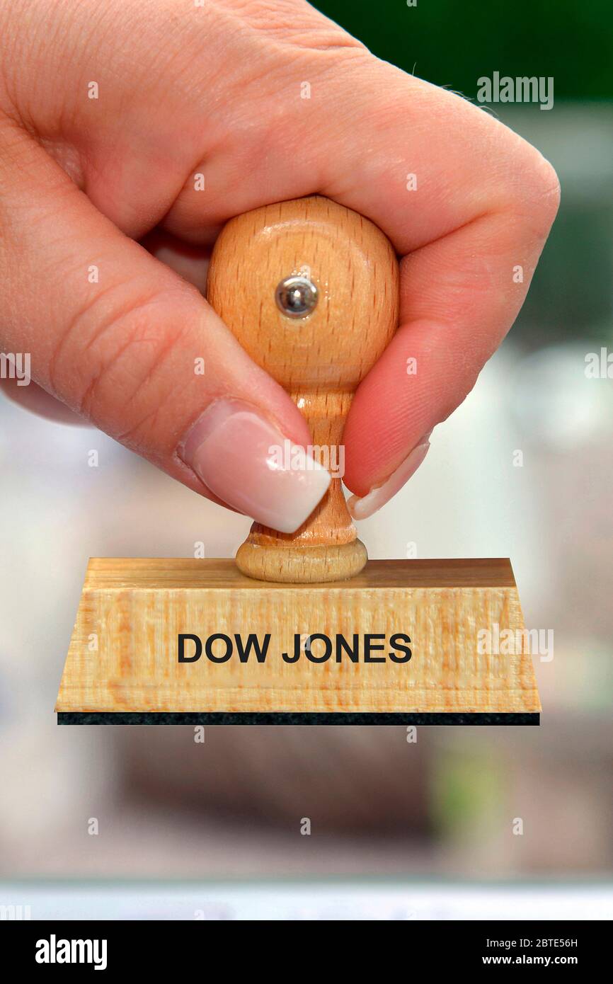 hand with stamp lettering DOW JONES Stock Photo - Alamy