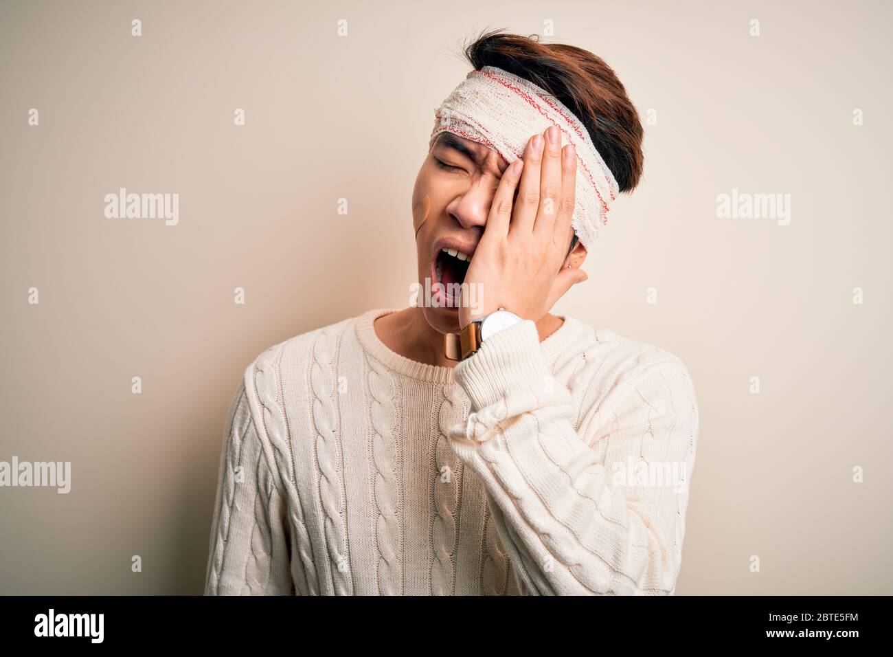 Young handsome chinese man injured for accident wearing bandage and ...