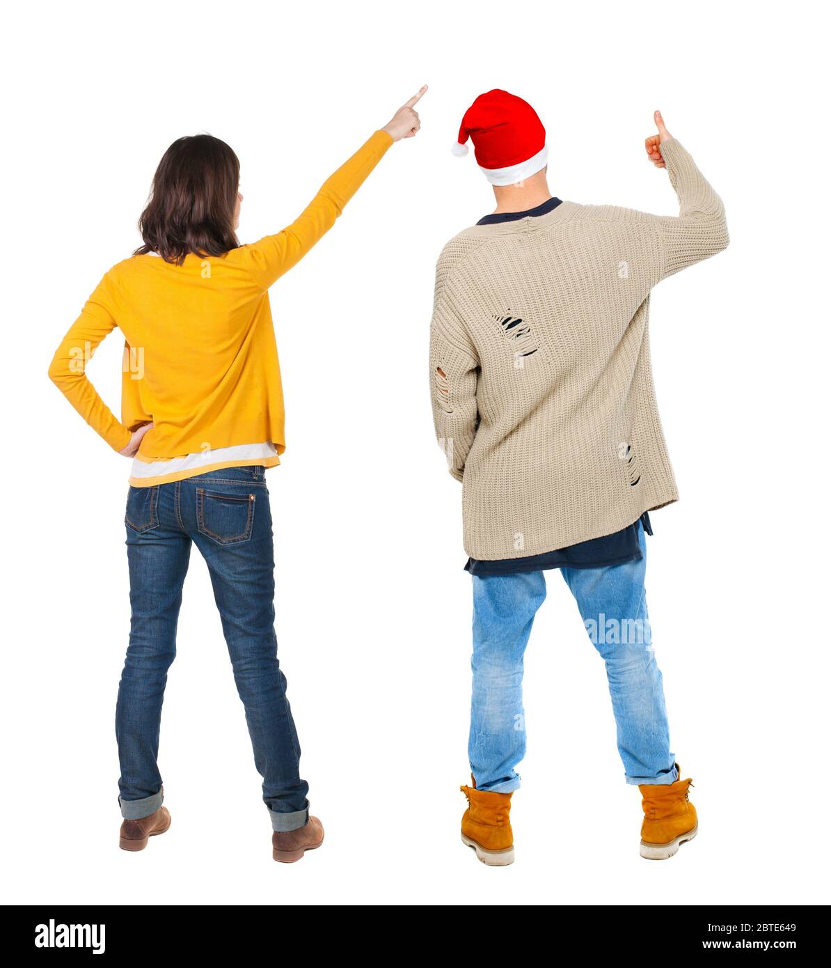 Back view of couple in sweater with mobile phone. beautiful friendly ...