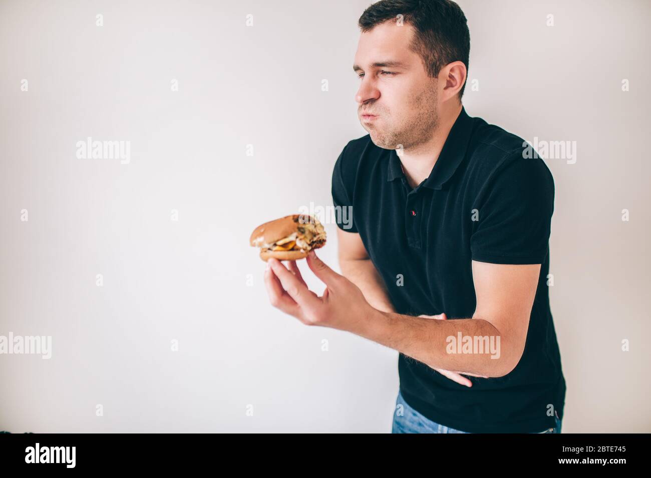 Young man isolated over white background. Sick guy suffer from vomit ...