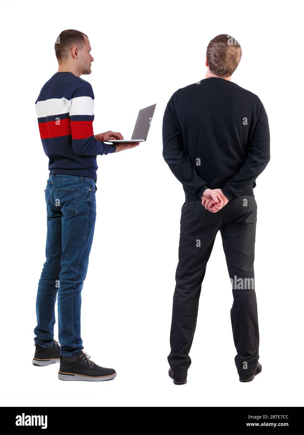 Back view two man in sweater with laptop. Rear view people collection ...