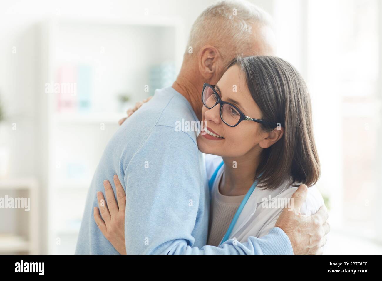 Doctor patient hugging in hospital hi-res stock photography and images ...