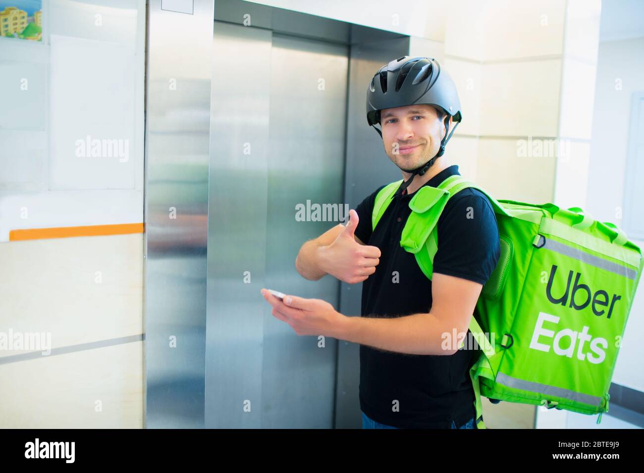 Kyiv, Ukraine - May 06, 2020: The Uber Eats courier. Food delivery ...