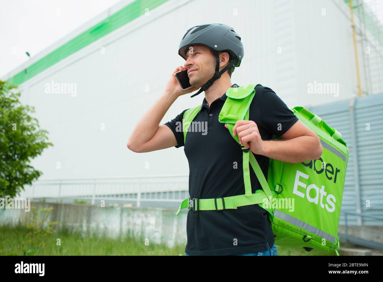 Kyiv, Ukraine - May 06, 2020: The Uber Eats courier. The food delivery ...