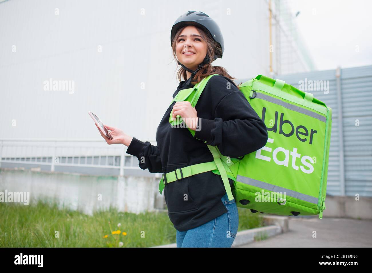 Kyiv, Ukraine - May 06, 2020: The Uber Eats courier. The food delivery ...