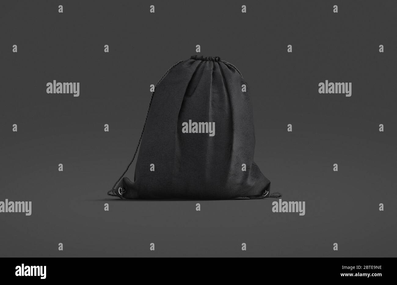 Blank black drawstring backpack mockup, dark background Stock Photo - Alamy