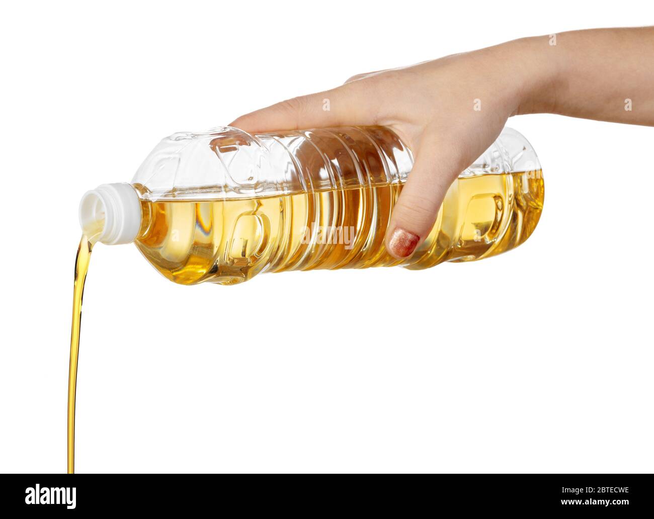 Hand of woman pouring cooking oil from plastic bottle. Isolated on ...