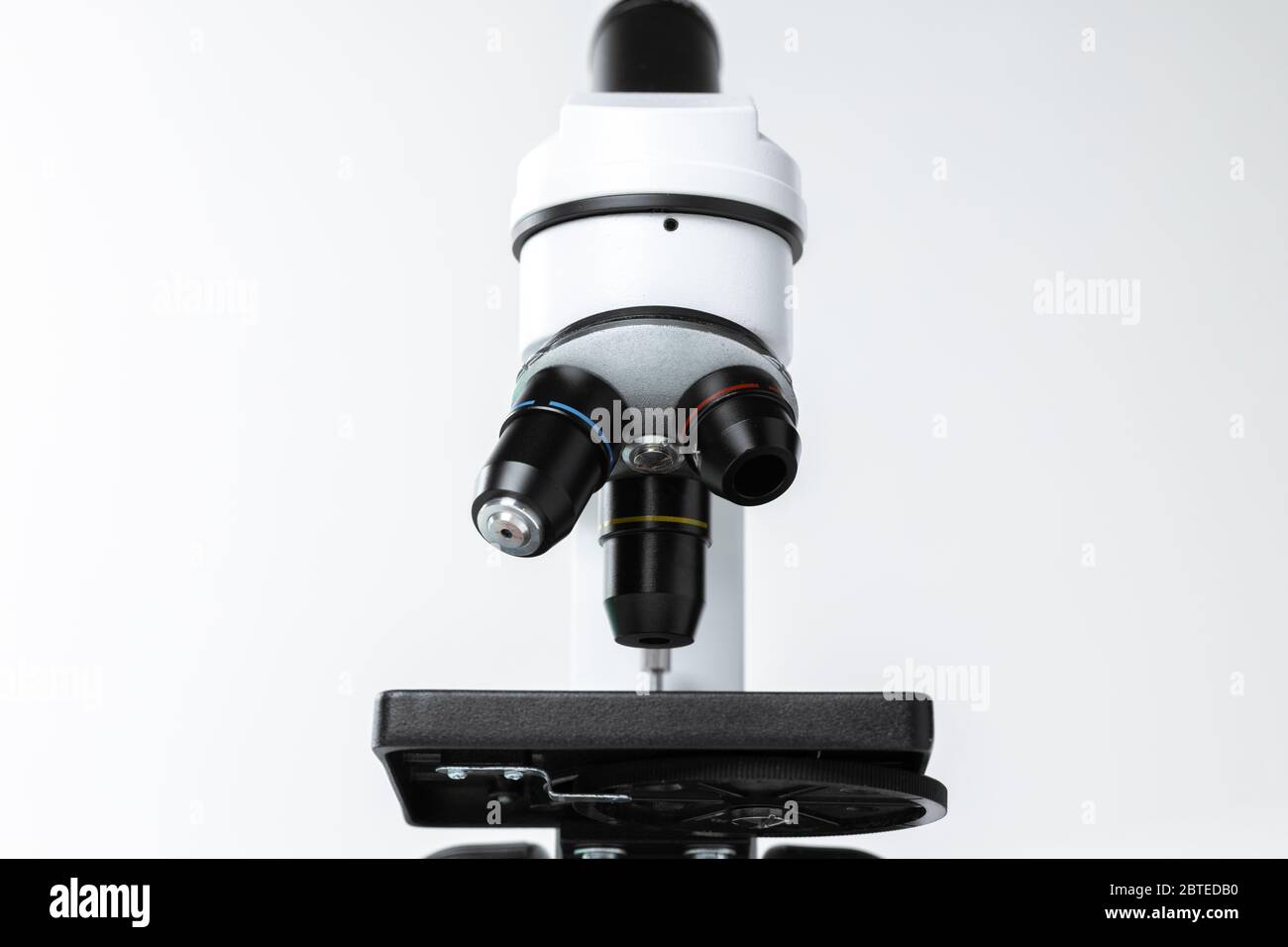 Mo0dern white laboratory microscope on white background Stock Photo - Alamy