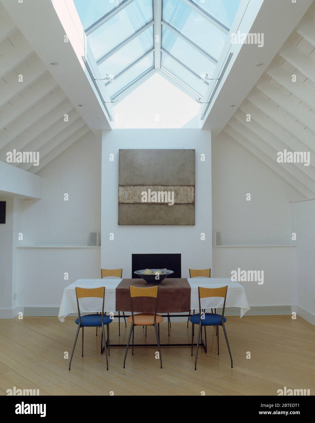Skylight in apex ceiling in large architectural dining room Stock Photo ...