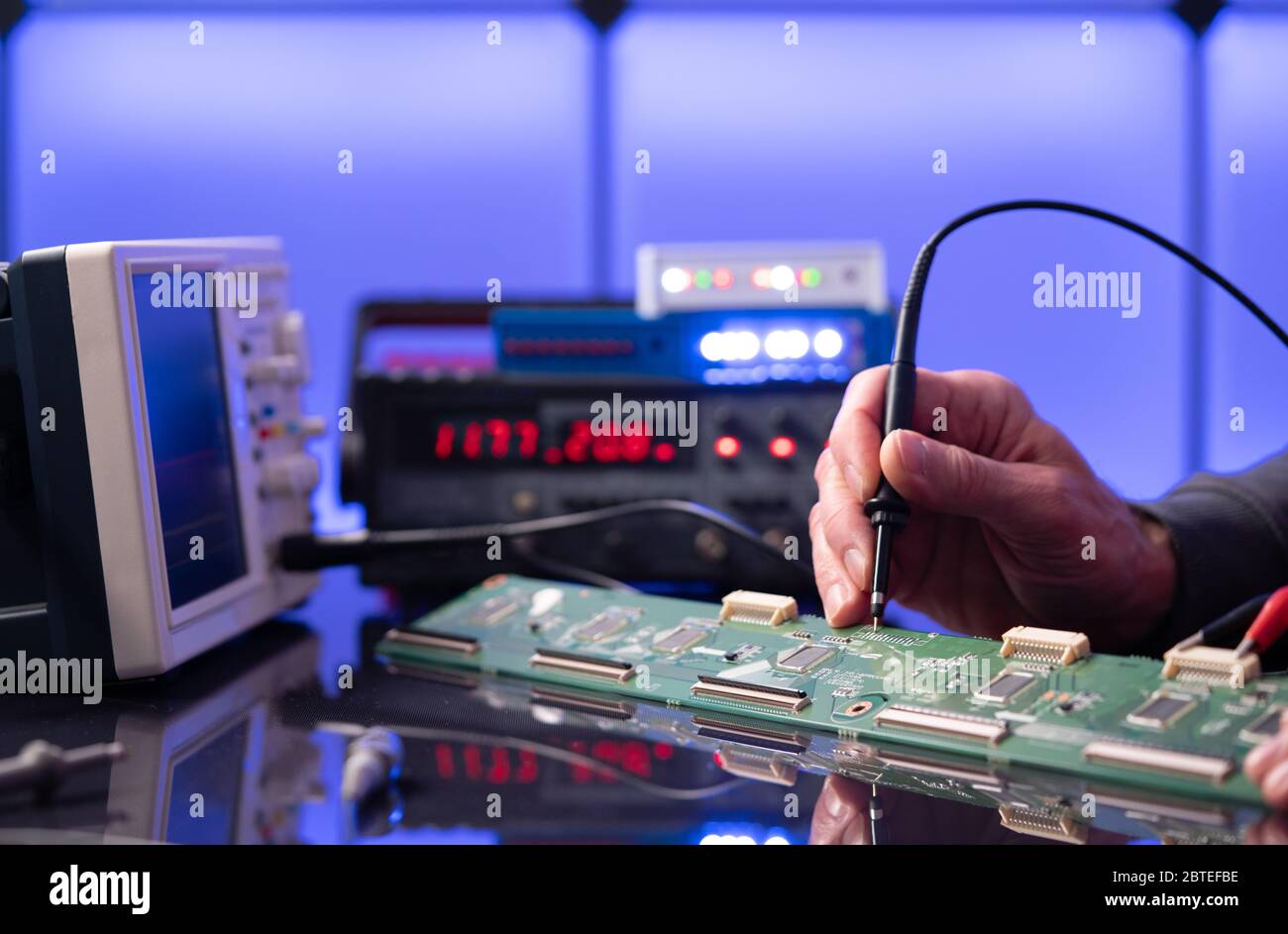Debugging electronics device. PCB witch microcontroller in electronics laboratory Stock Photo ...