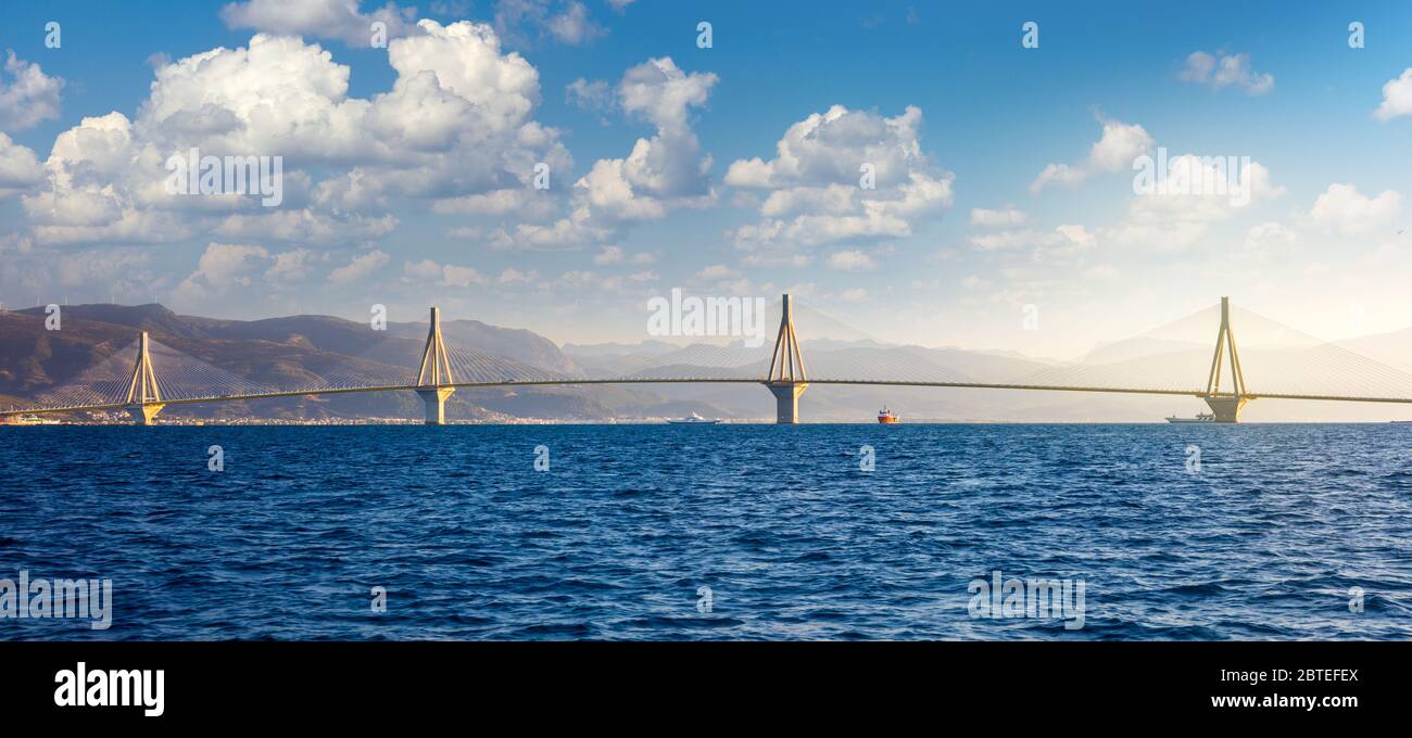 Panoramic view of Modern Bridge with white clouds. Rion-Antirion Bridge ...